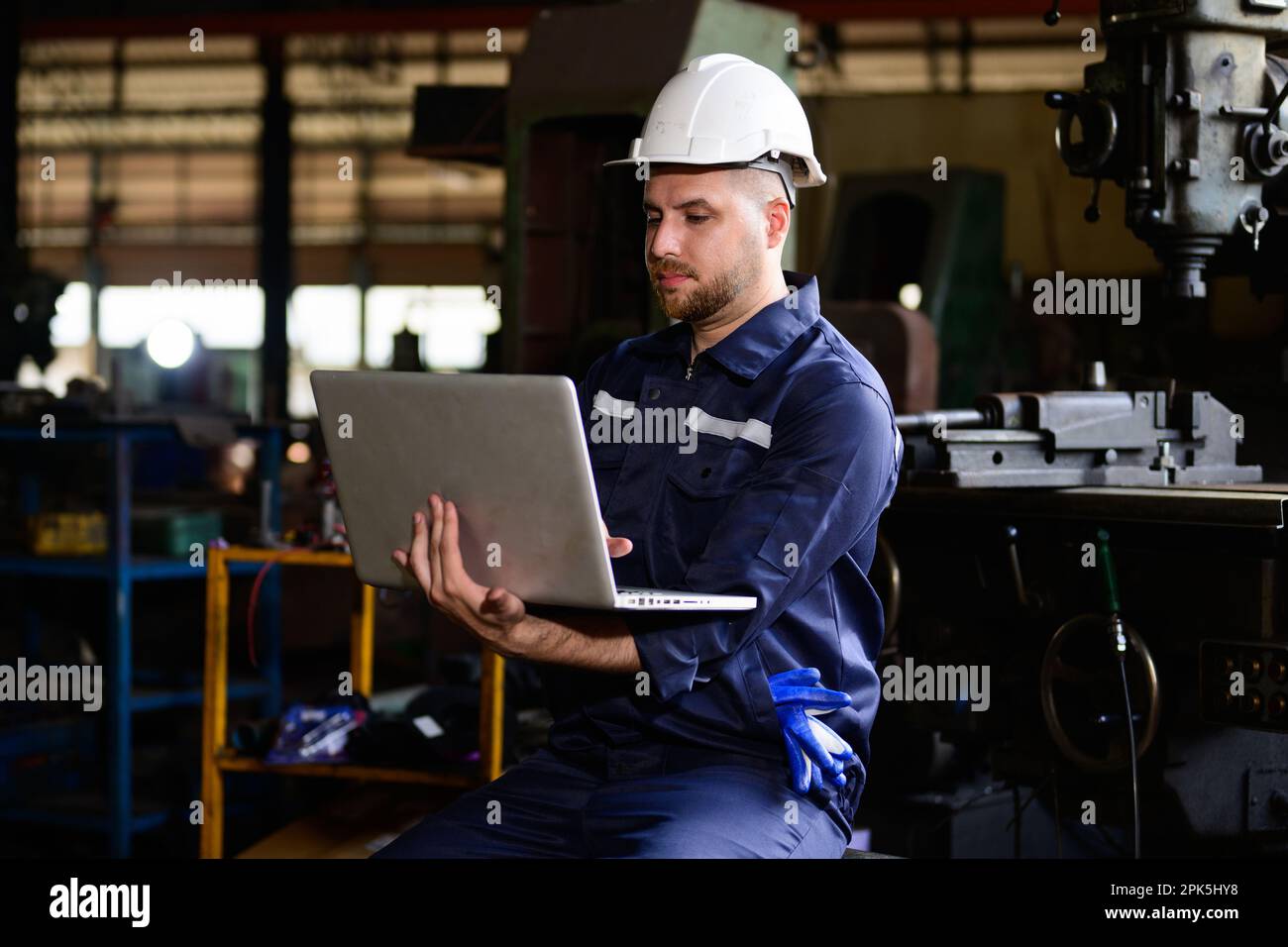 Maintenance engineer worker working at manufacturing plant factory ...
