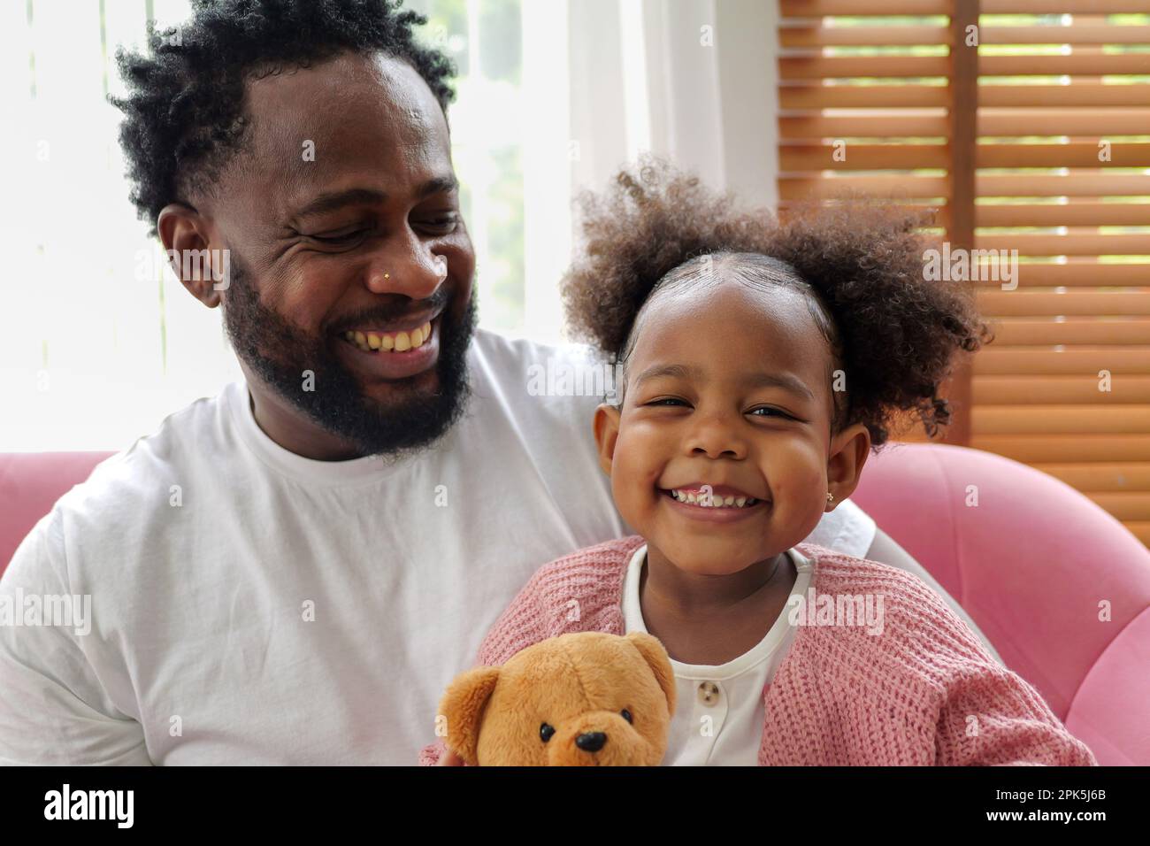 Kid and father smile to camera. Happy daughter play fun with father ...