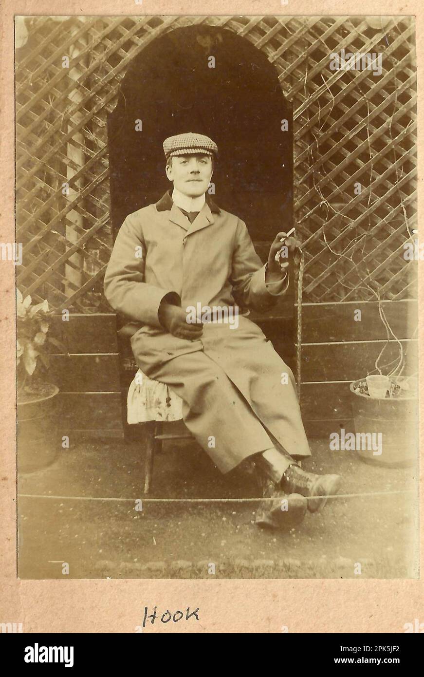 John Hook seated in the garden, with walking cane and cigarette Stock Photo - Alamy