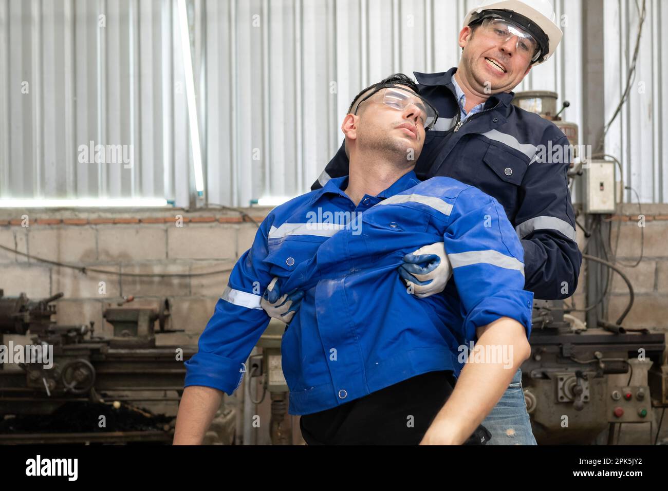 Engineer worker with accident at factory during working Stock Photo - Alamy