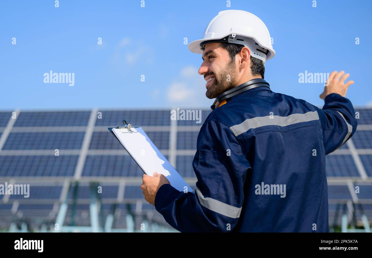 Technician worker installing solar panels at solar cell farm Stock ...