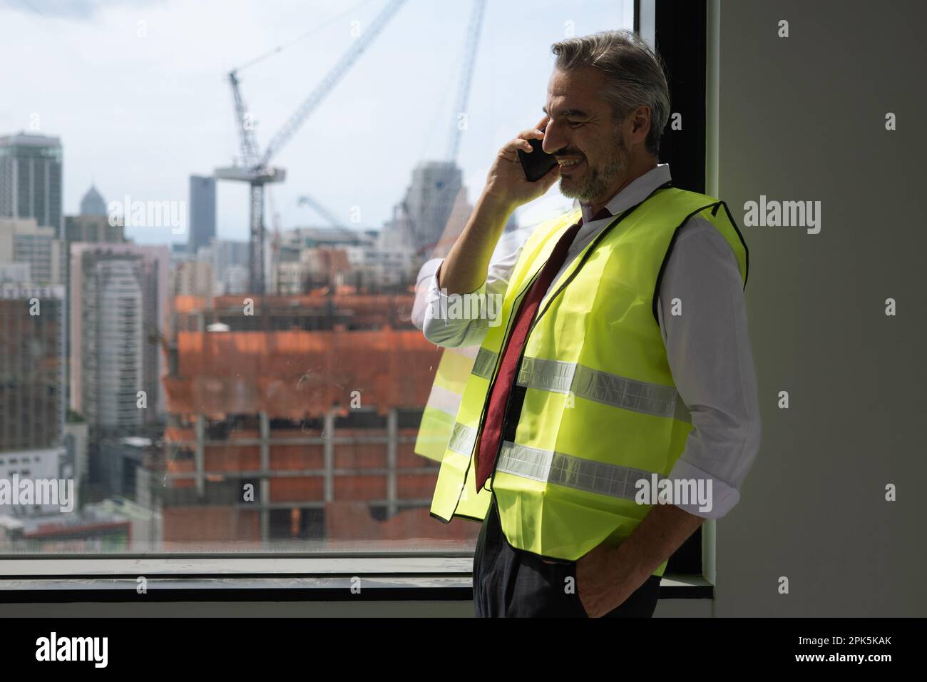 Portrait happy civil engineer talking hi-res stock photography and ...