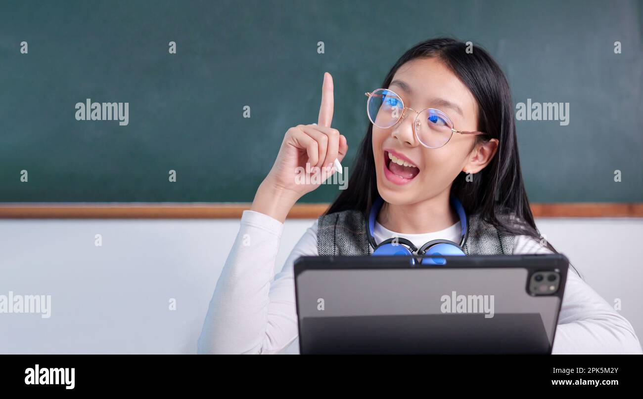 Student studying and reading textbook with happiness in classroom Stock ...