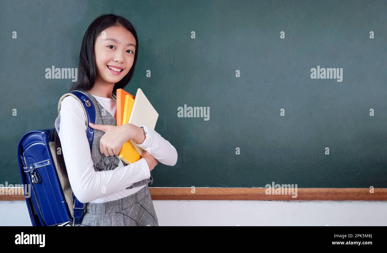 Student studying and reading textbook with happiness in classroom Stock ...