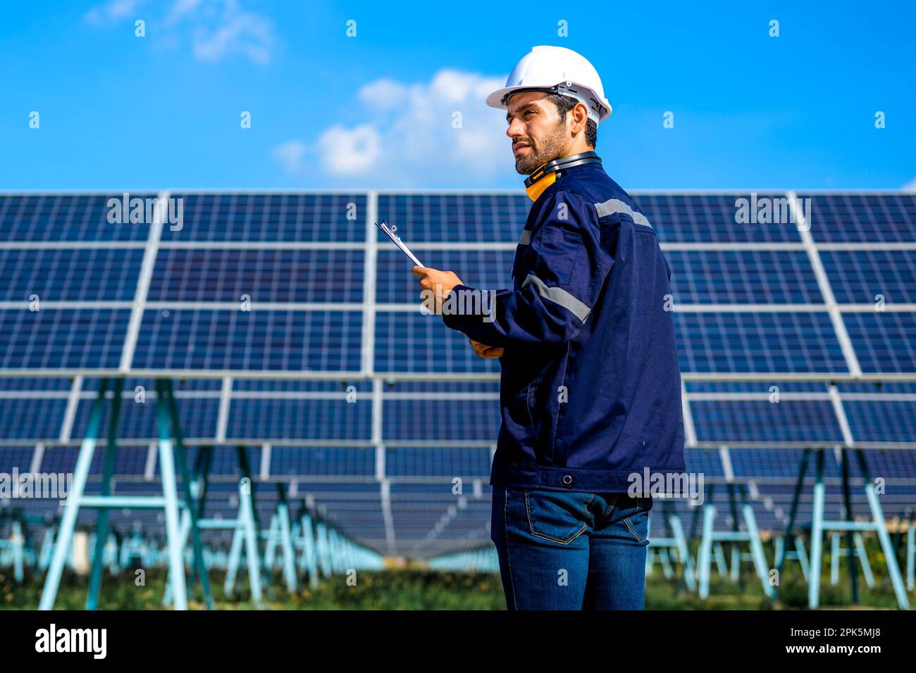 Engineer worker portrait with solar panel at solar farm Stock Photo - Alamy
