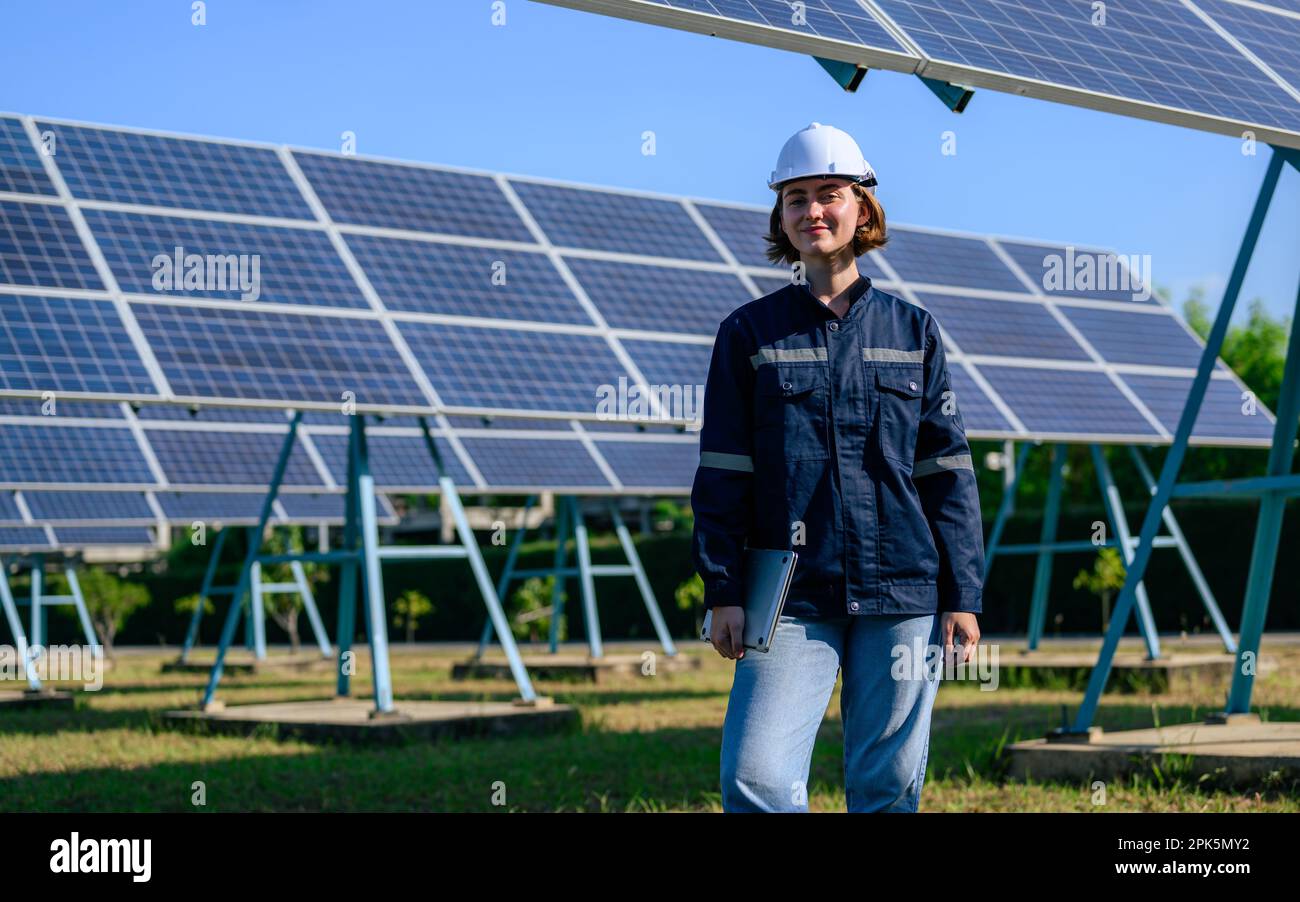 Engineer worker portrait with solar panel at solar farm Stock Photo - Alamy
