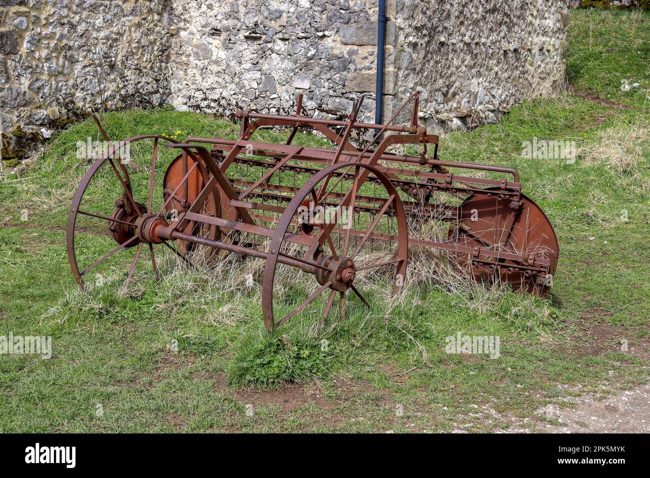 Overgrown old farm equipment hi-res stock photography and images - Alamy