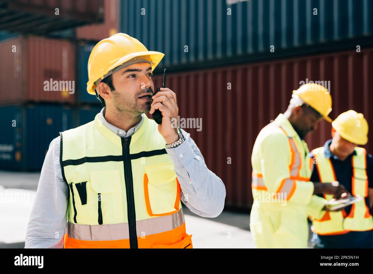 Warehouse engineer worker working at industrial container yard Stock ...