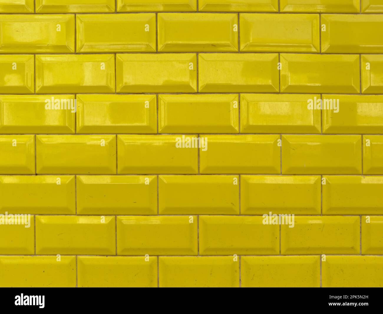 Yellow rectangular ceramic tiles wall texture Stock Photo - Alamy