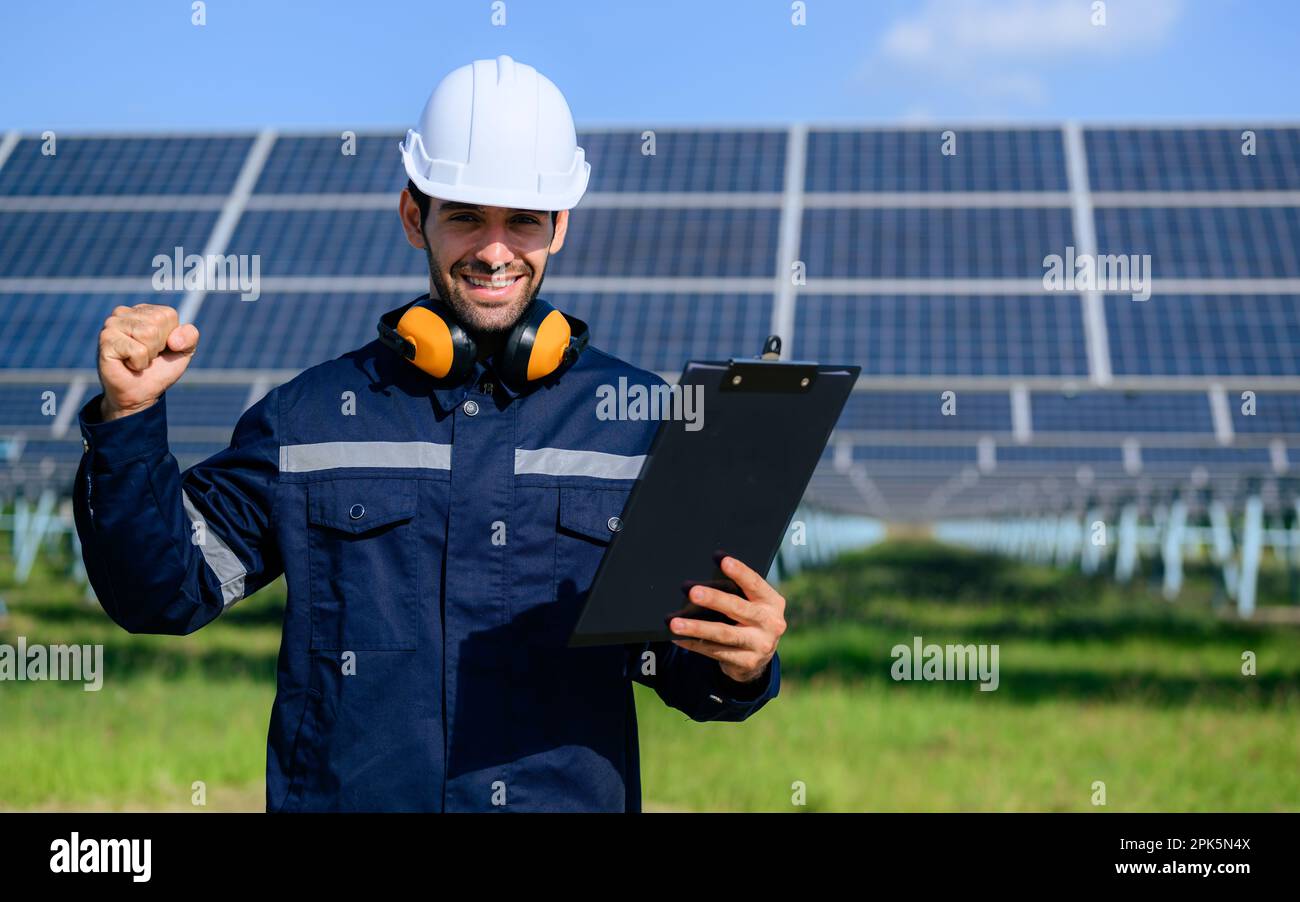 Engineer worker portrait with solar panel at solar farm Stock Photo - Alamy