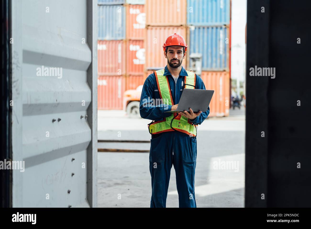Warehouse engineer worker working at industrial container yard Stock ...