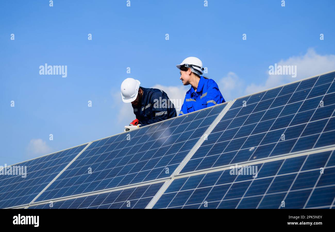 Technicians workers team installing solar panels at industrial solar ...