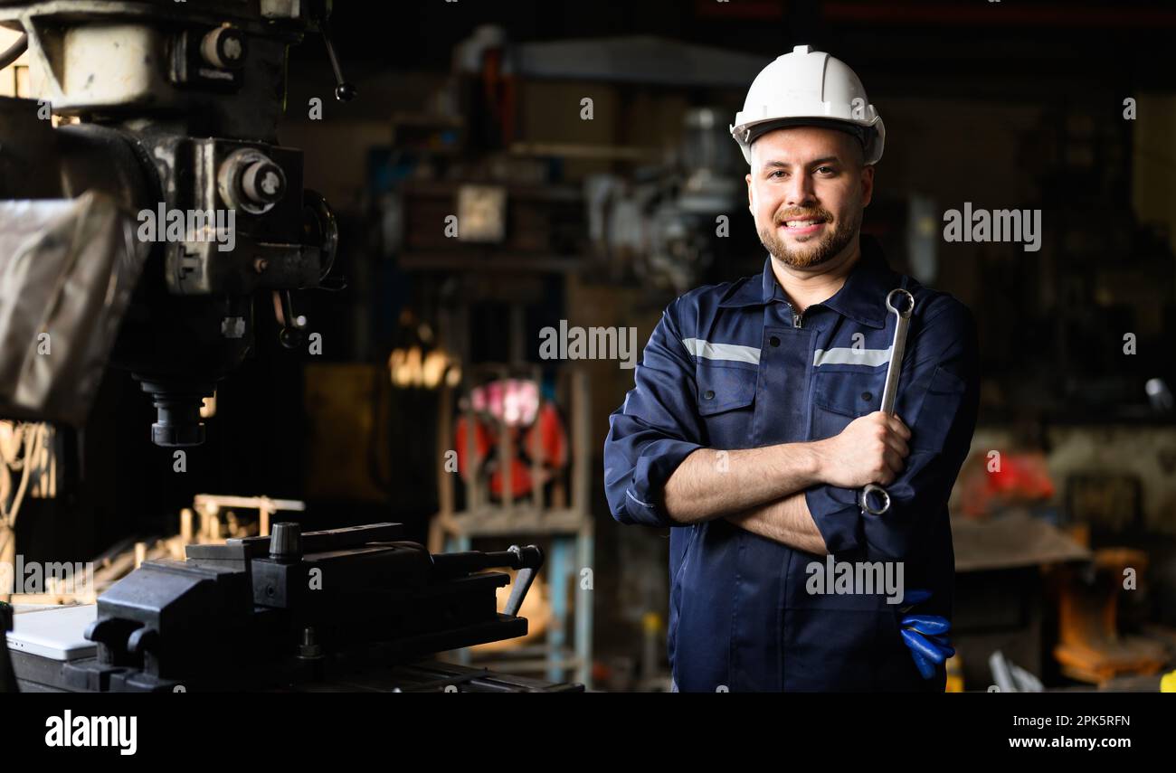 Portrait of happy mechanical engineer smiling with arm crossed Stock ...