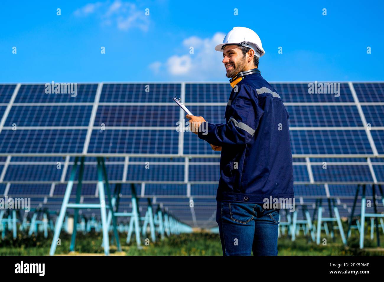 Engineer worker portrait with solar panel at solar farm Stock Photo - Alamy
