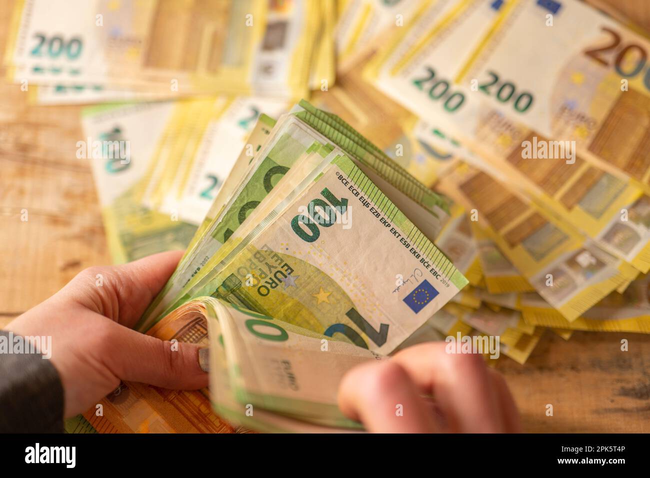 Money counting. Recalculation of money.200 euro banknotes. Counting ...
