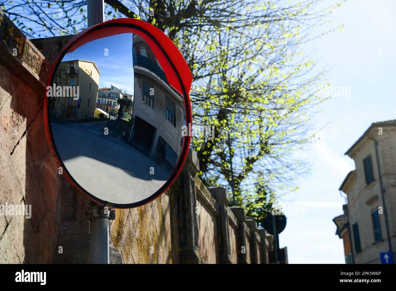 Traffic mirror on city street, space for text Stock Photo - Alamy