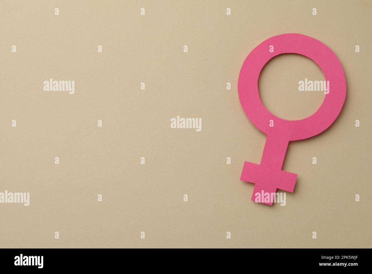 Female gender sign and space for text on beige background, top view ...