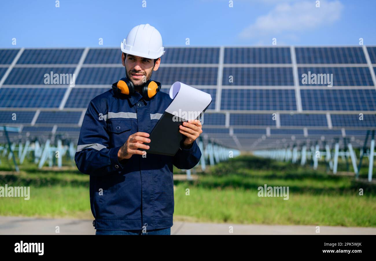 Engineer worker portrait with solar panel at solar farm Stock Photo - Alamy