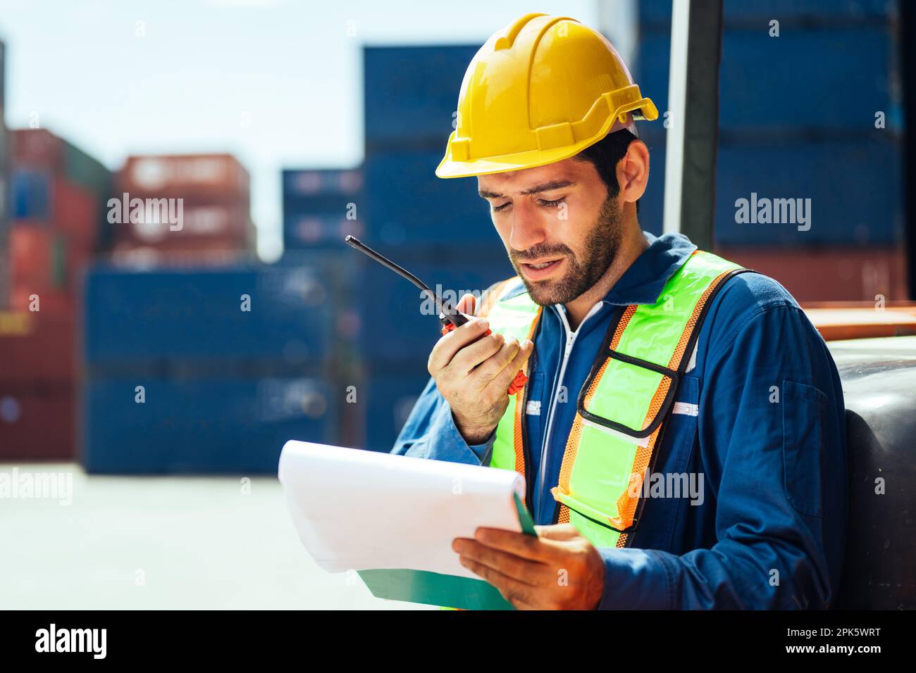 Industrial warehouse foreman working at overseas shipping container ...