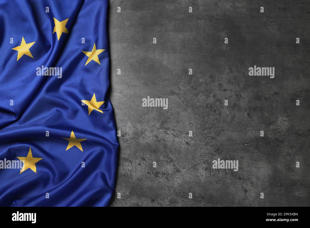 Flag of European Union on grey stone background, top view. Space for ...