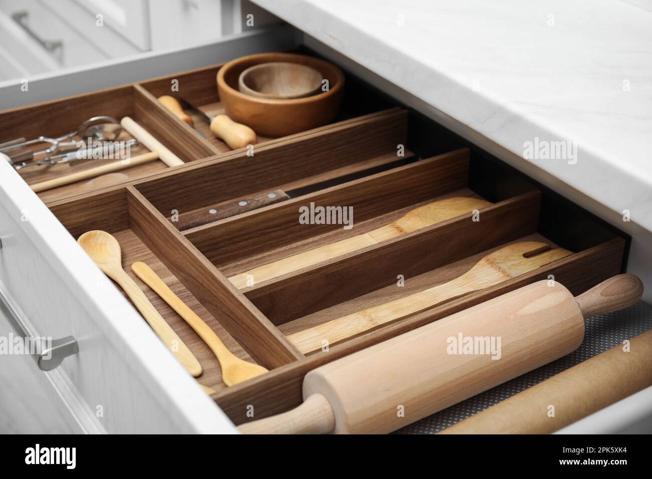 Open drawer of kitchen cabinet with different utensils, closeup Stock ...