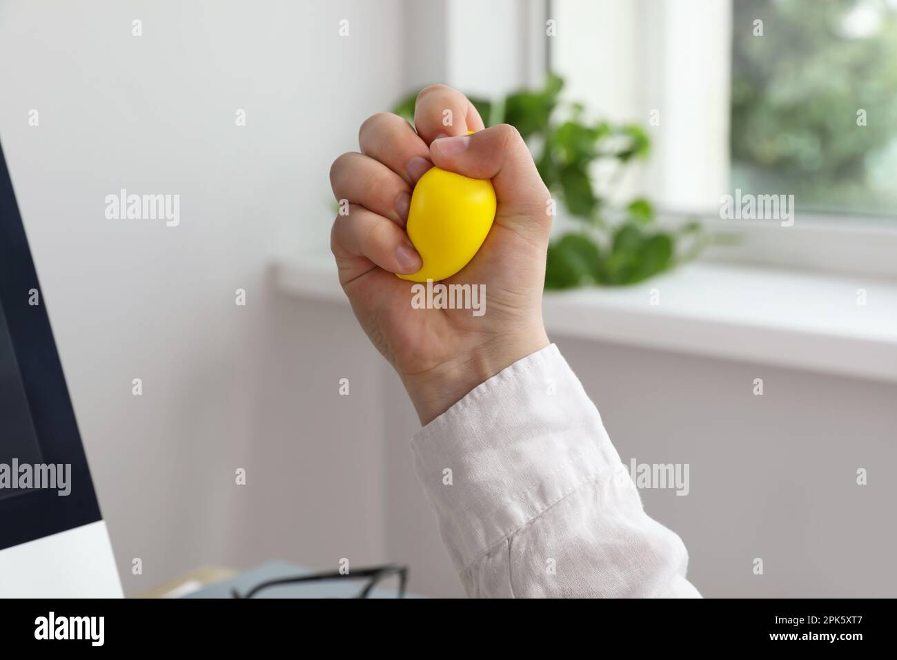 Yellow stress ball in hi-res stock photography and images - Alamy