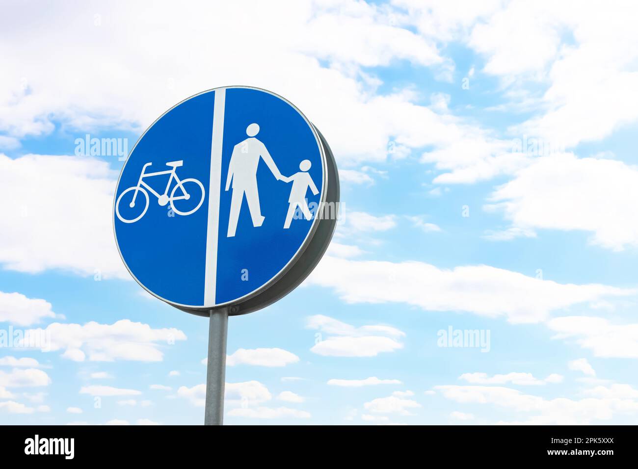 Road sign Shared Lane Bicycles and Pedestrians on spring day Stock ...