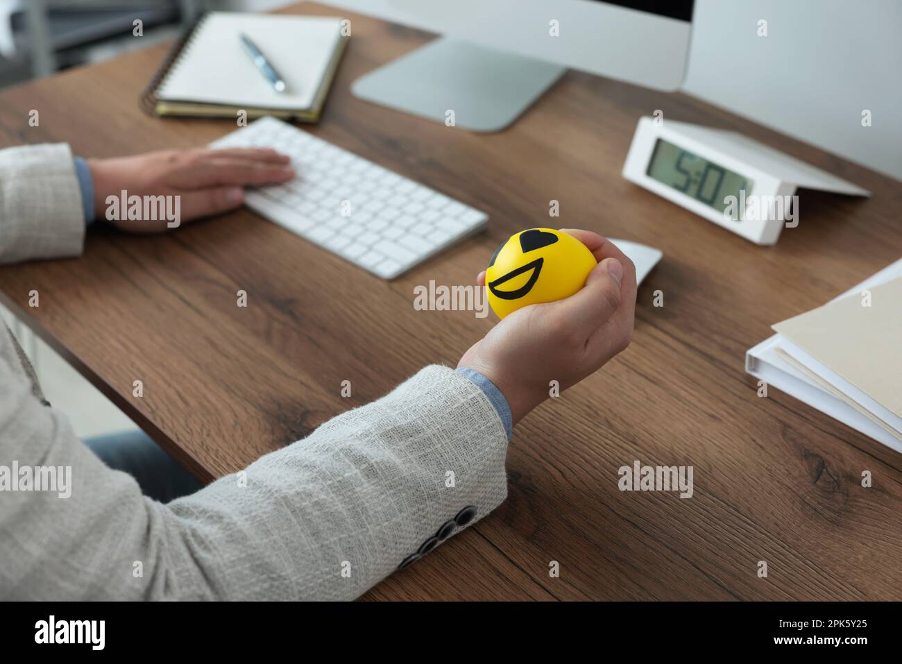 Man squeezing ball desk hi-res stock photography and images - Alamy