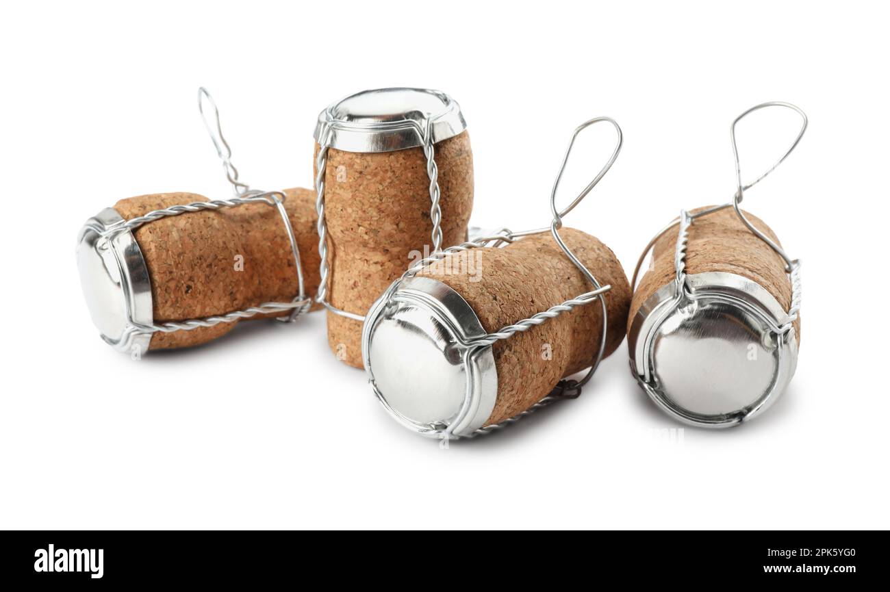 Sparkling wine corks with muselet caps on white background Stock Photo ...