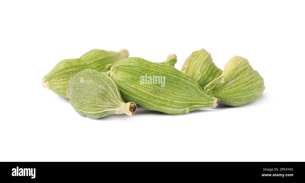 Pile of dry green cardamom on white background Stock Photo - Alamy