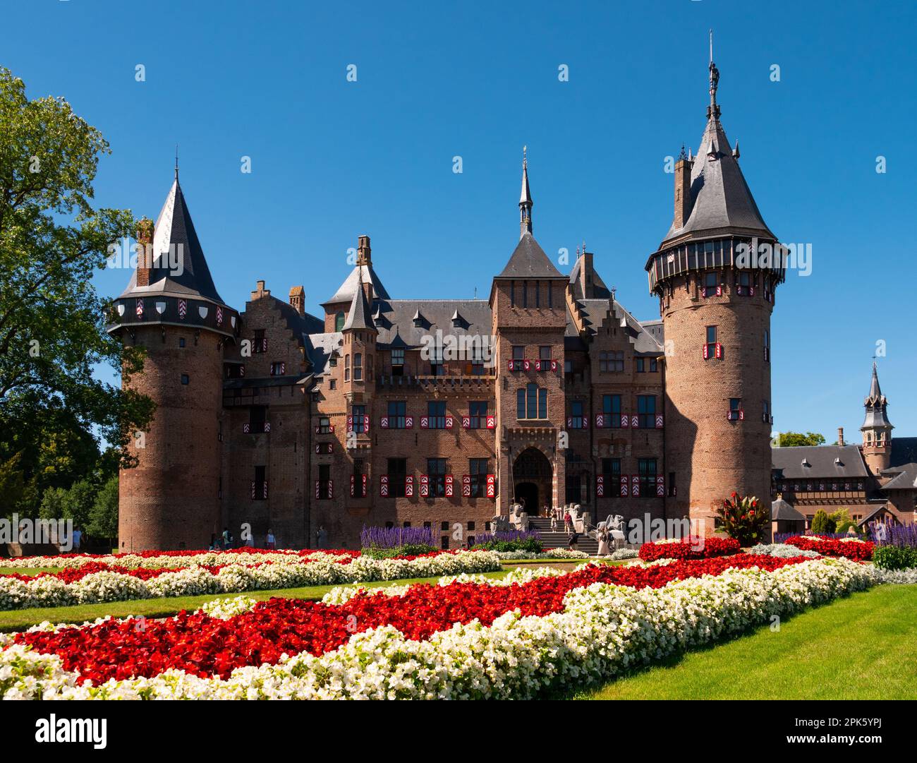 Ancient medieval castle and beautiful flower bed Stock Photo - Alamy