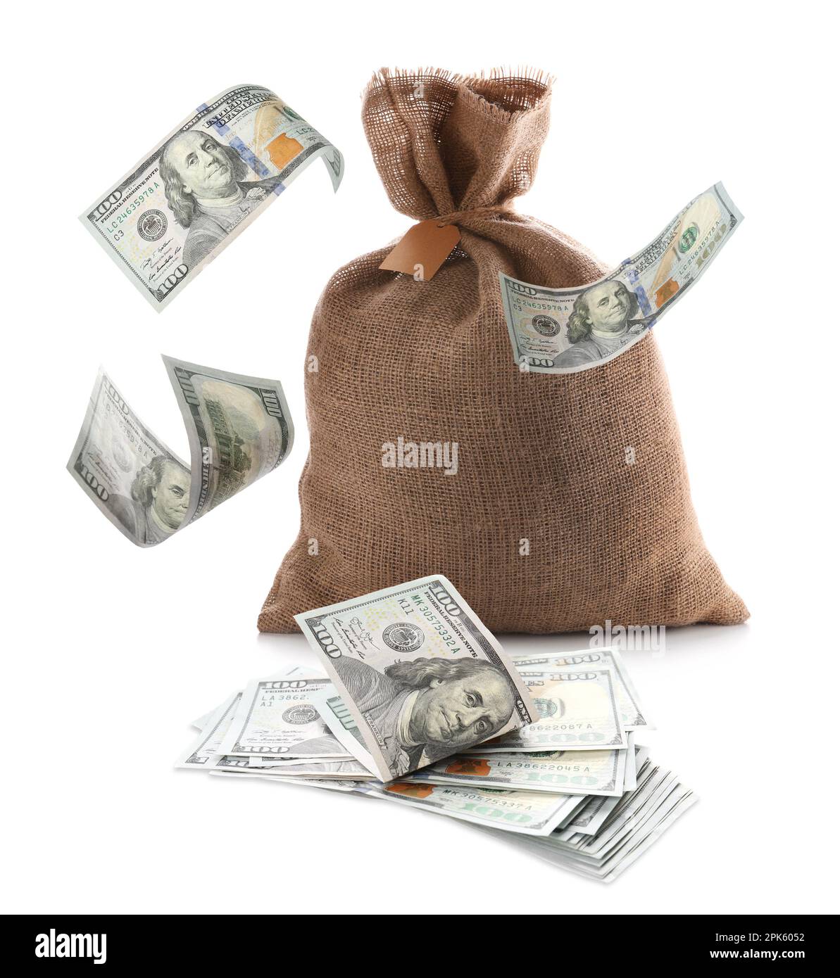 Burlap bag and flying dollar banknotes on white background Stock Photo ...