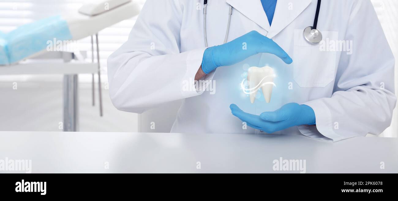 Dentist demonstrating virtual model of healthy tooth indoors, closeup ...