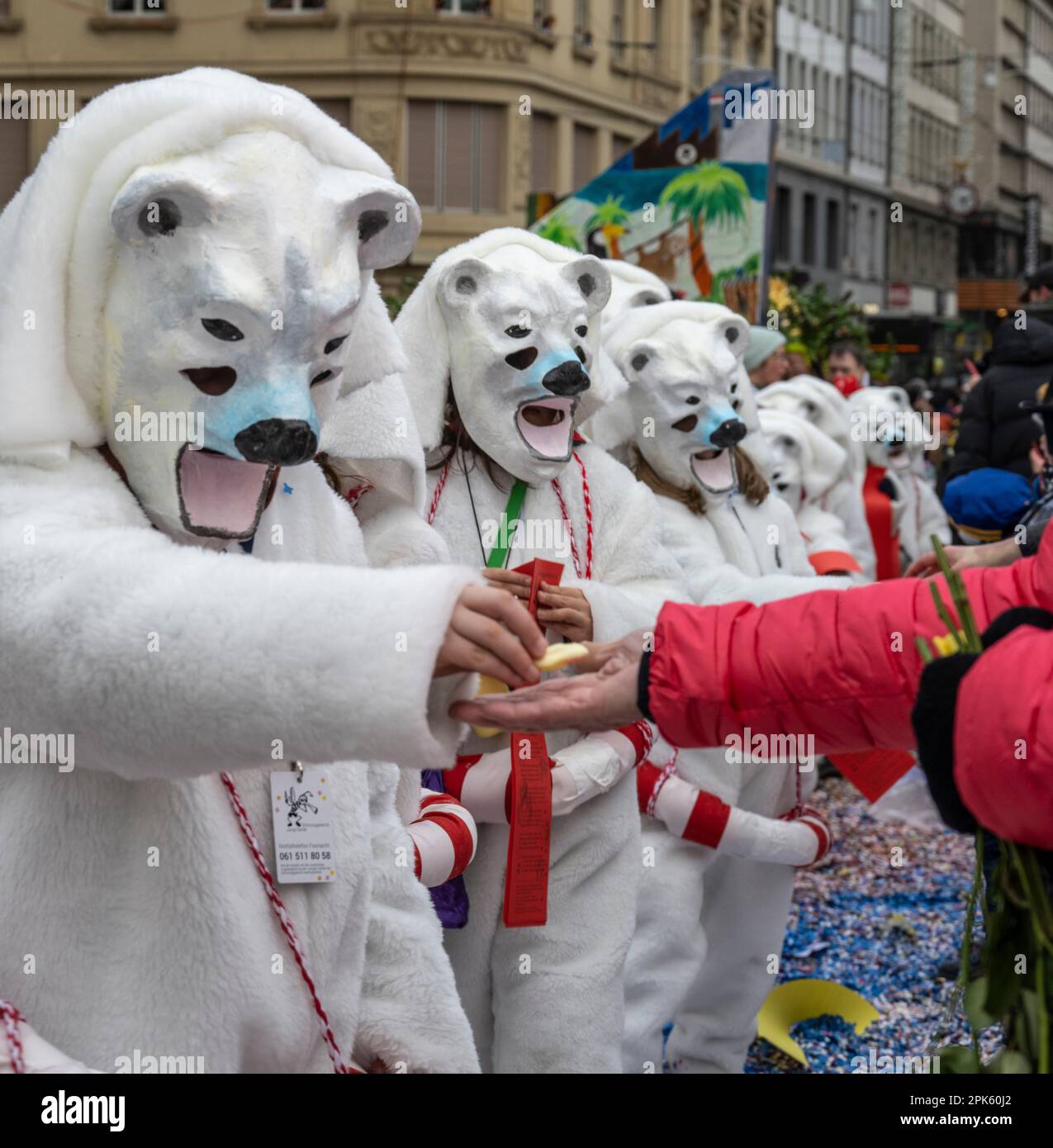 polar bear Costume at the Basel Fasnacht parade in Switzerland handing ...