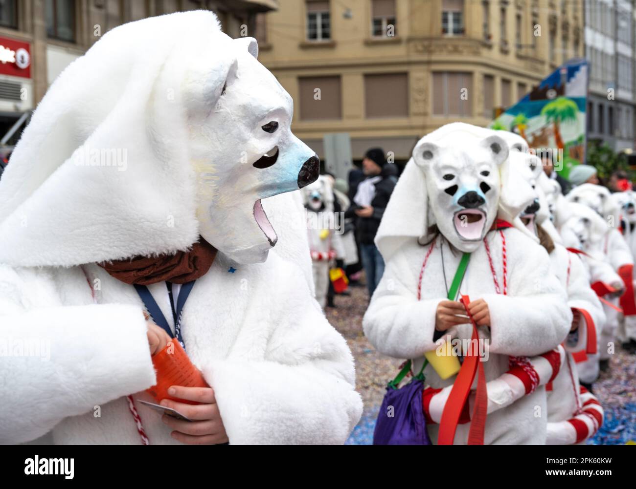 polar bear Costume at the Basel Fasnacht parade in Switzerland handing ...