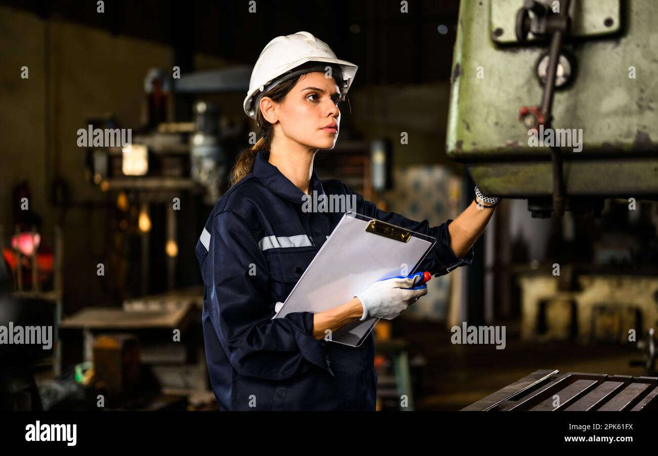 Female mechanical engineer manager checking and inspecting engine ...