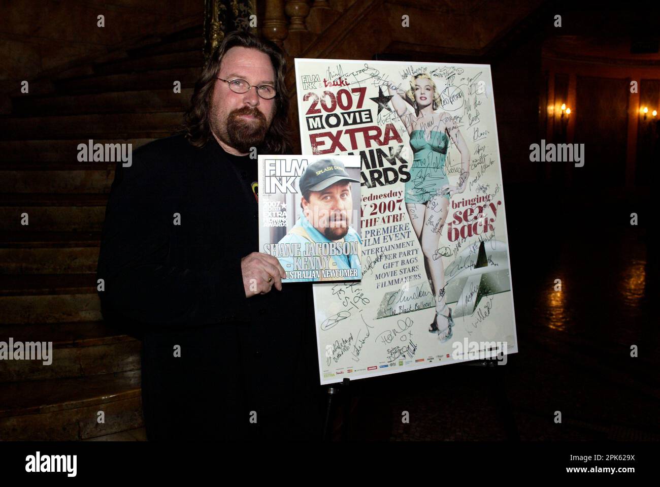 Clayton Jacobson poses with one of two Filmink Awards given to the film ...