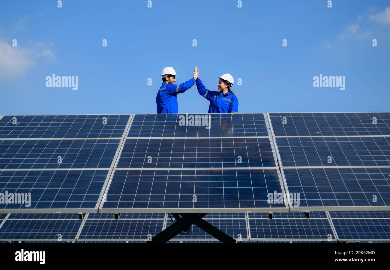 Technicians workers team installing solar panels at industrial solar ...
