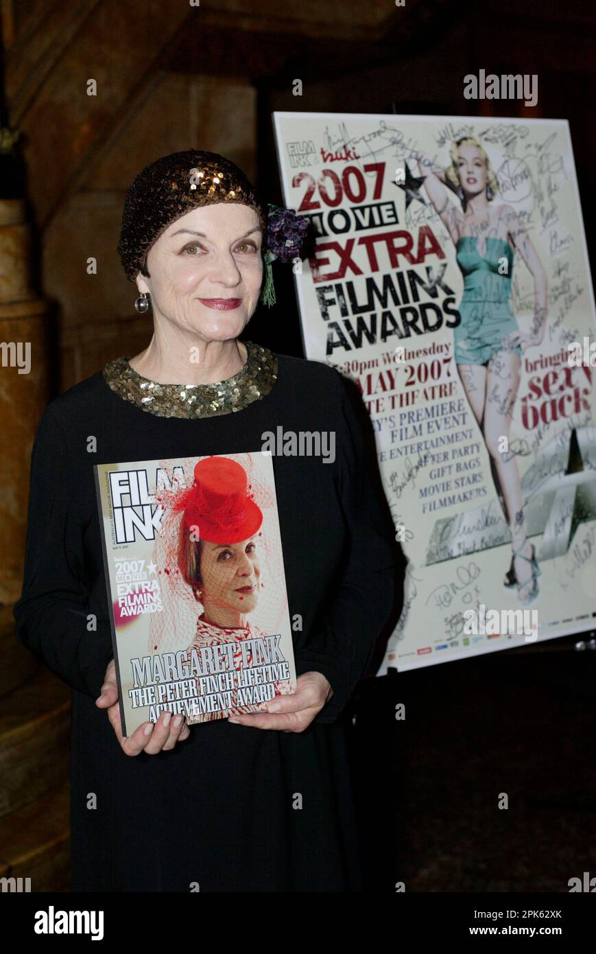 Margarent Fink poses with her Filmink Lifetime Achievement Award at the ...