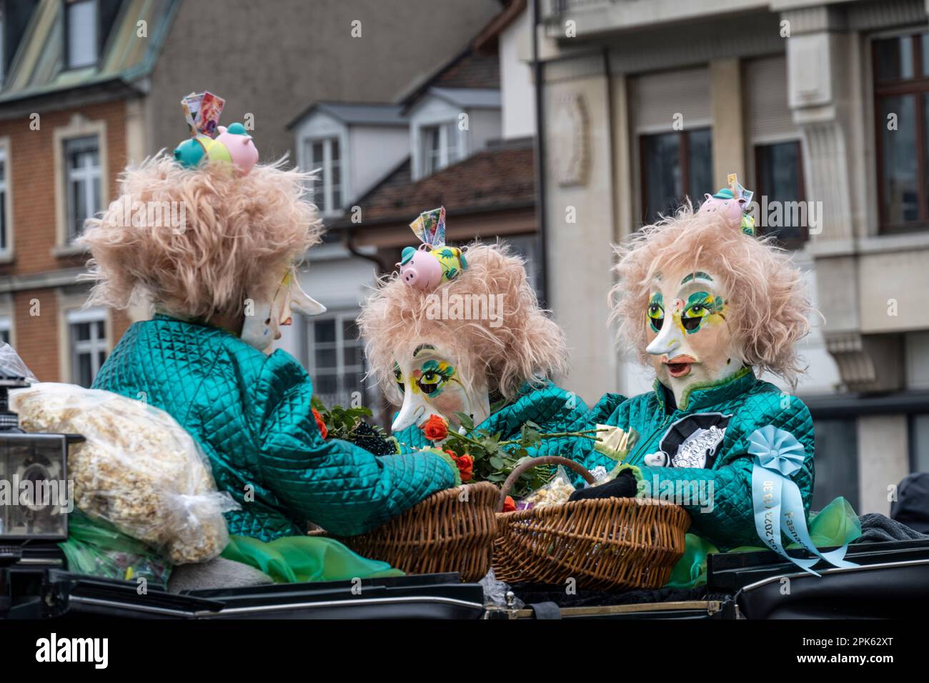 Old Aunt Costume in a carriage at the Basel Fasnacht parade in ...