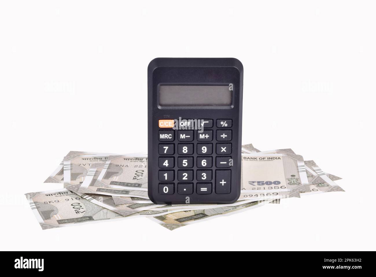 Calculator with indian money isolated on white background with clipping ...