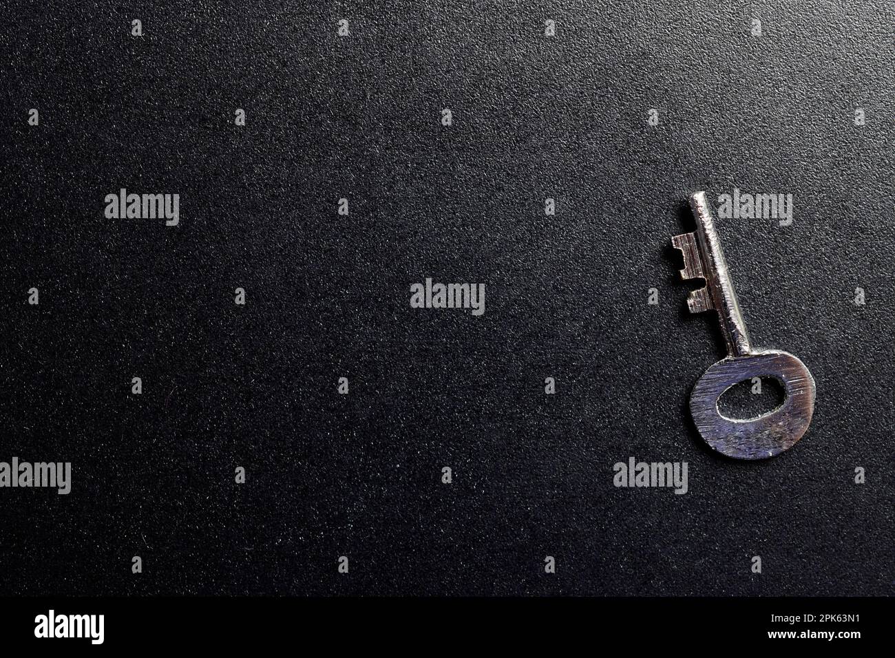 Top view of metal key on black background with text space Stock Photo ...
