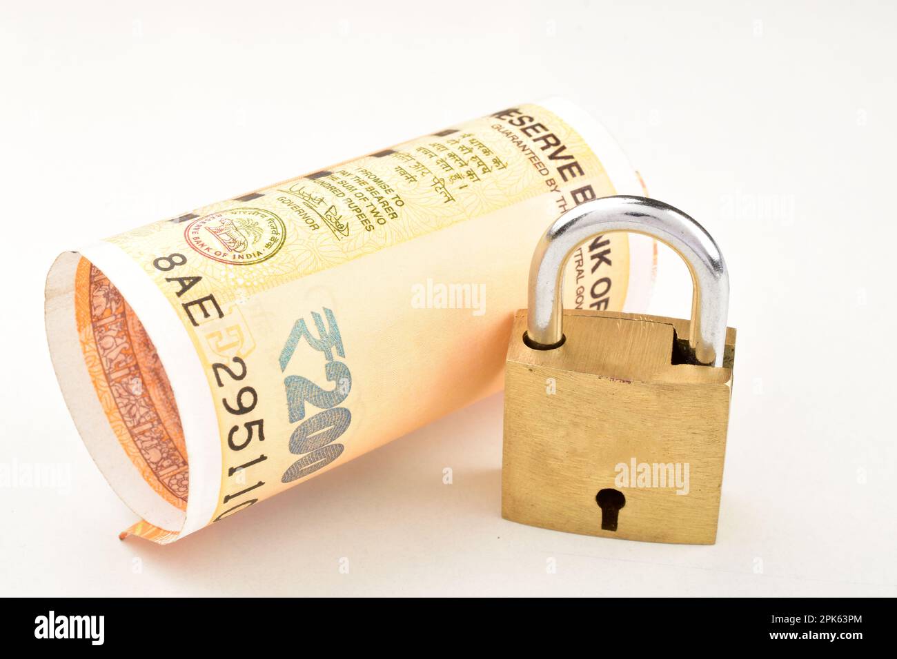 Indian currency note with lock on white background Stock Photo - Alamy