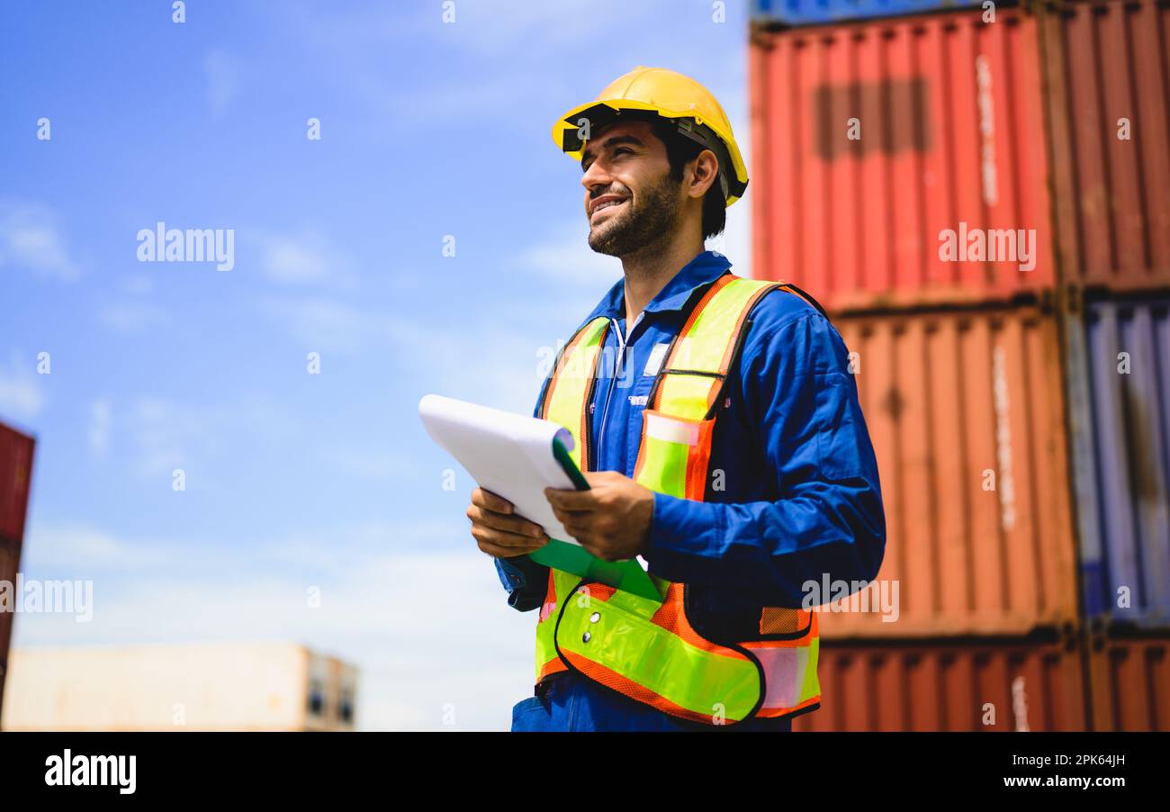 Professional industrial engineer worker working at container cargo yard ...