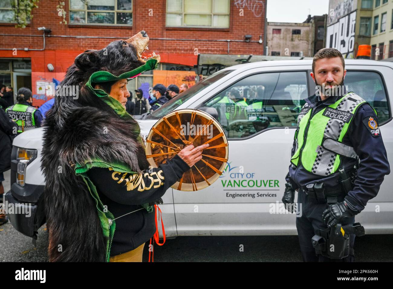 Woman with bear skin protests removal of Homeless peoples tents ...