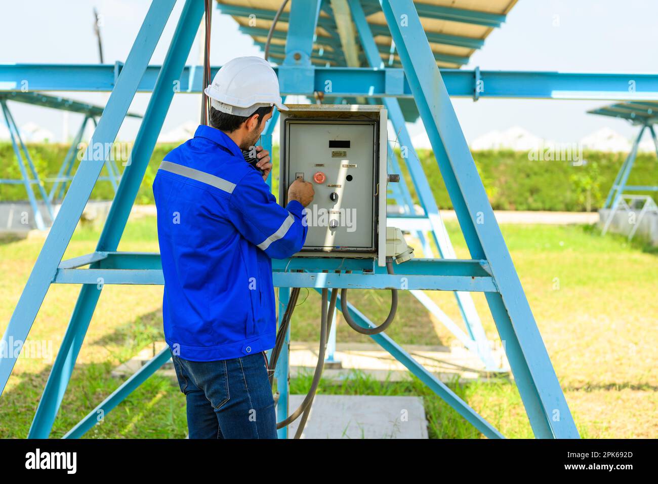 Workers installing solar panels, Engineer team at solar panel farm ...