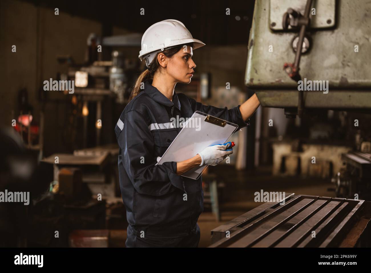 Worker checking factory warehouse inspecting hi-res stock photography ...