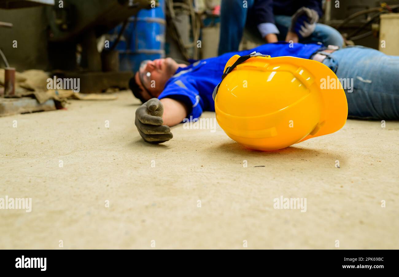 Male engineer with accident at factory, People with injury from hard ...