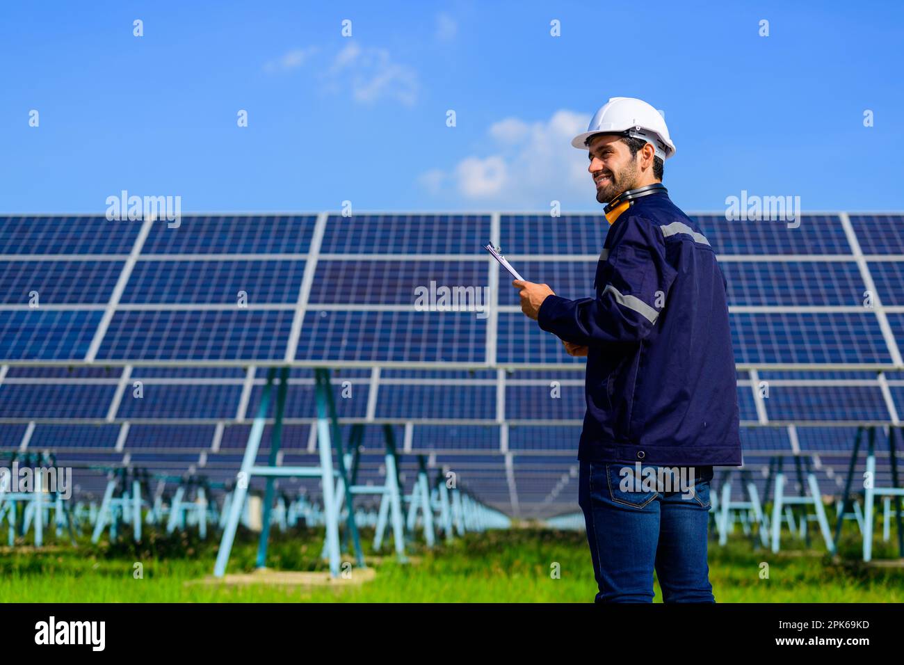 Engineer worker portrait with solar panel at solar farm Stock Photo - Alamy