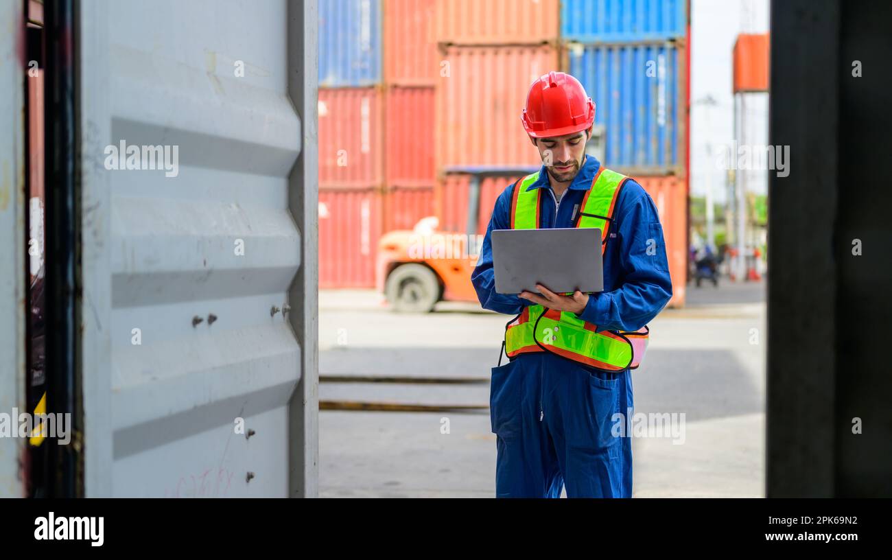 Warehouse engineer worker checking and working at industrial container ...
